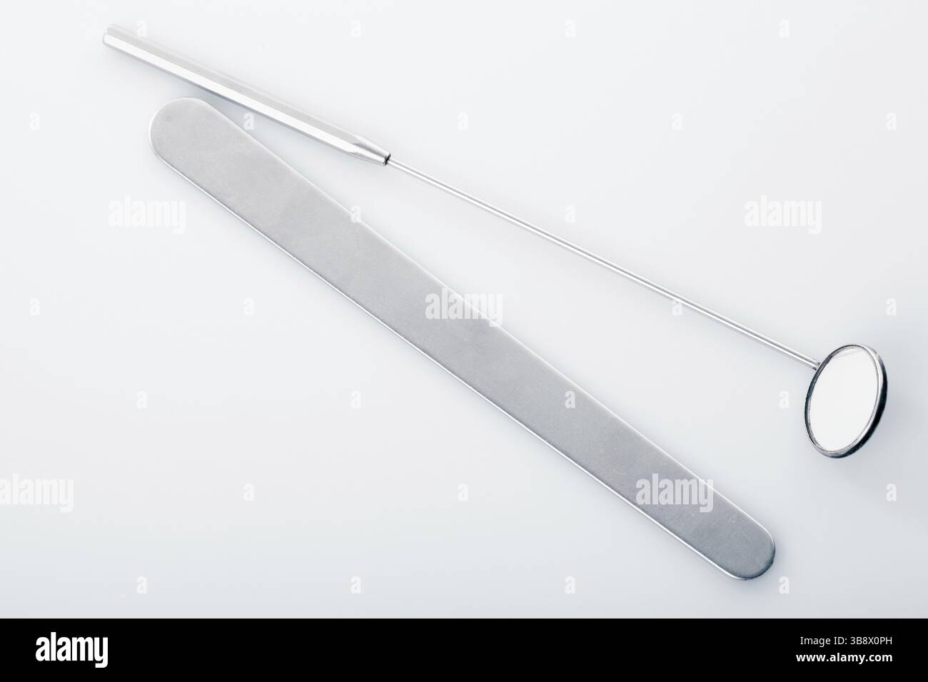 Medical instruments for ENT doctor: mirror and scapula for throat ...
