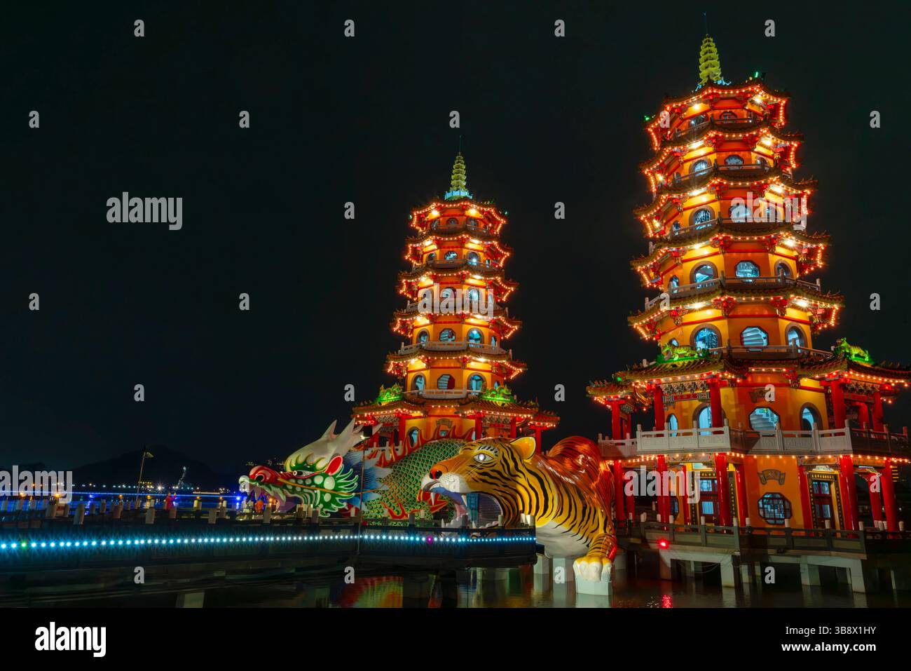 Night view of Dragon tower and Tiger tower. Dragon and Tiger Pagodas is ...