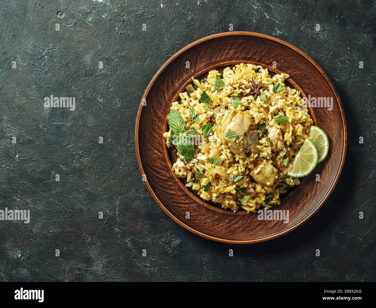 Pakistani food - biryani rice with chicken on plate. Delicious ...