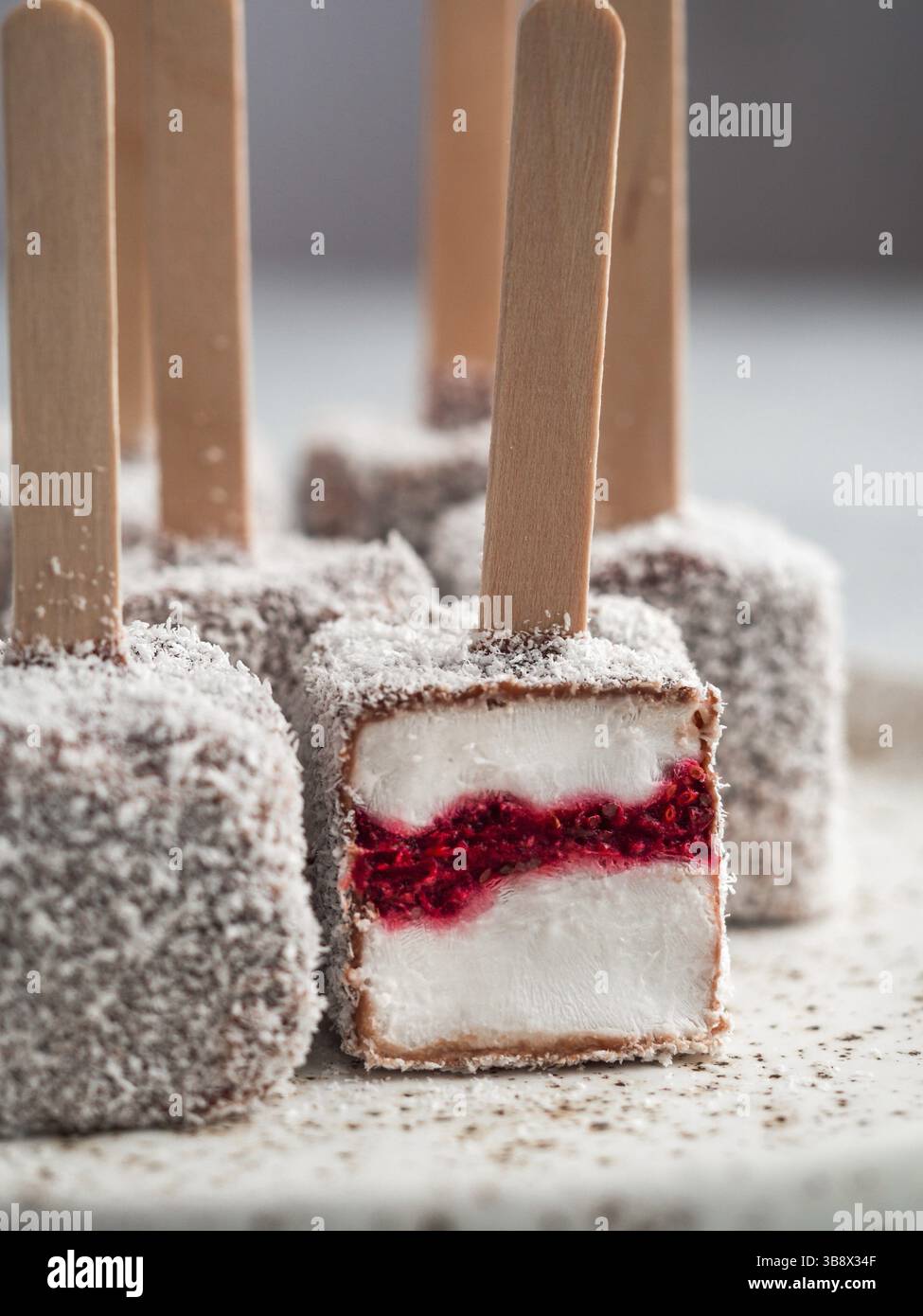 Homemade raw lamington ice cream pops on light background. Australian ...