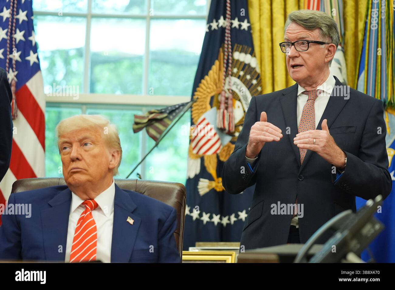 President Donald Trump, listening to Britian's ambassador to the Peter ...