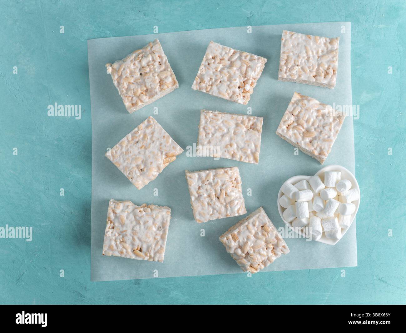 Homemade square bars of Marshmallow and crispy rice and ingredients on ...