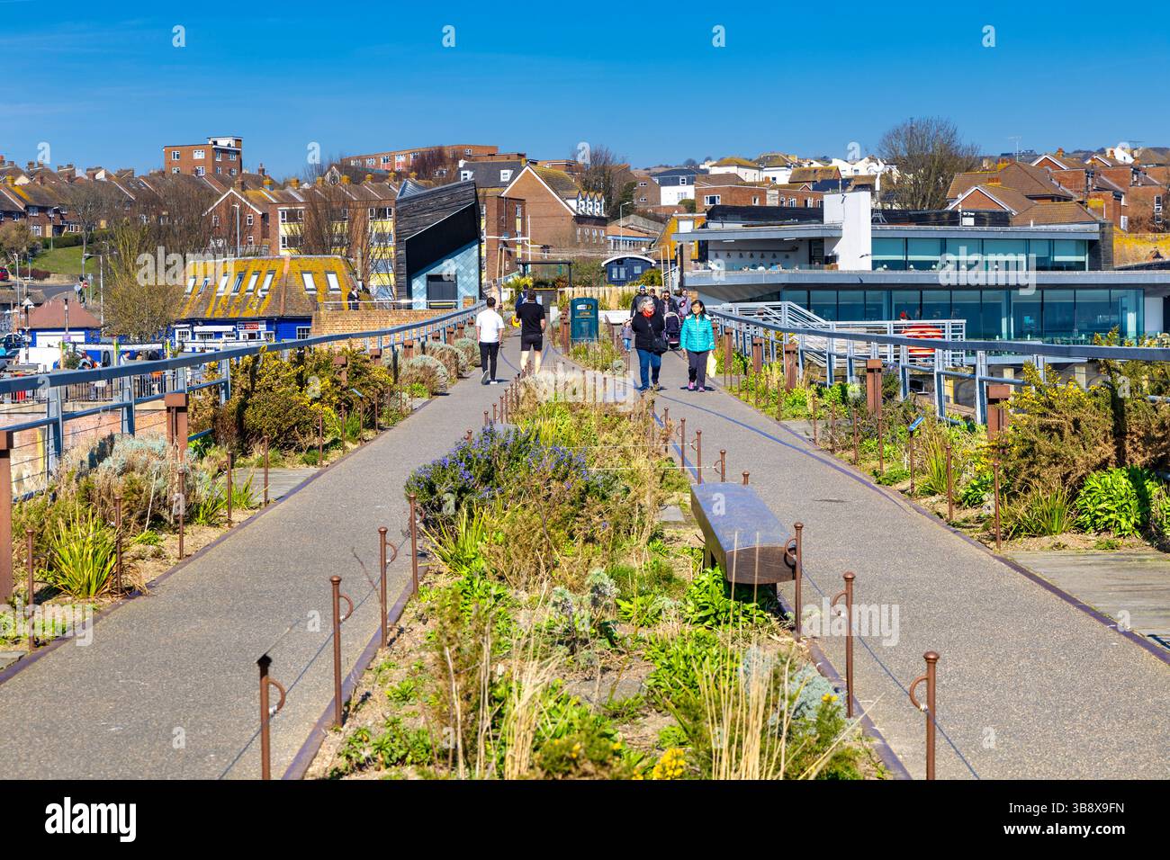 People walking along the landscaped linear park and walkway Folkestone ...
