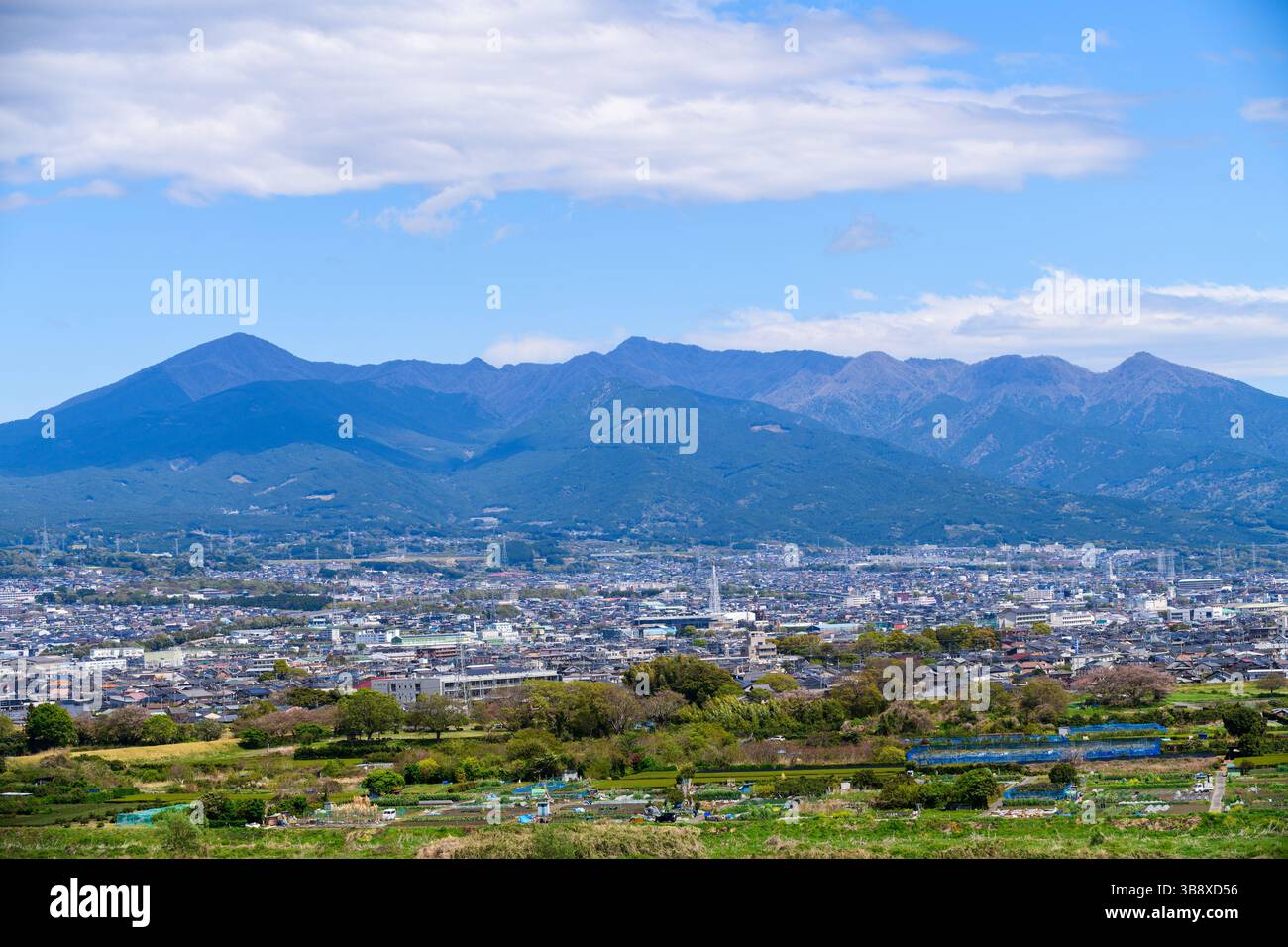 This panoramic landscape captures the peaceful coexistence of urban ...
