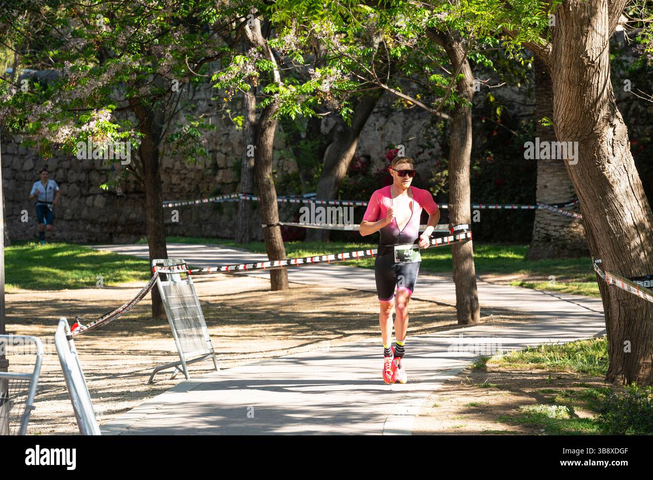 Man running in the park of Valencia during the "Iron Man" half Marathon ...