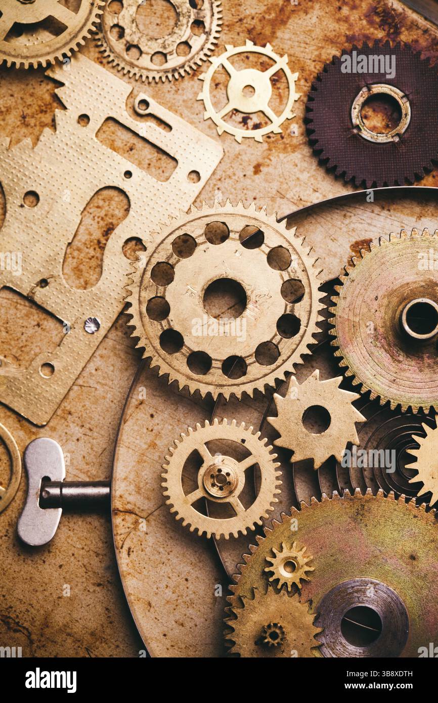 Steampunk background from mechanical clocks details over old metal ...
