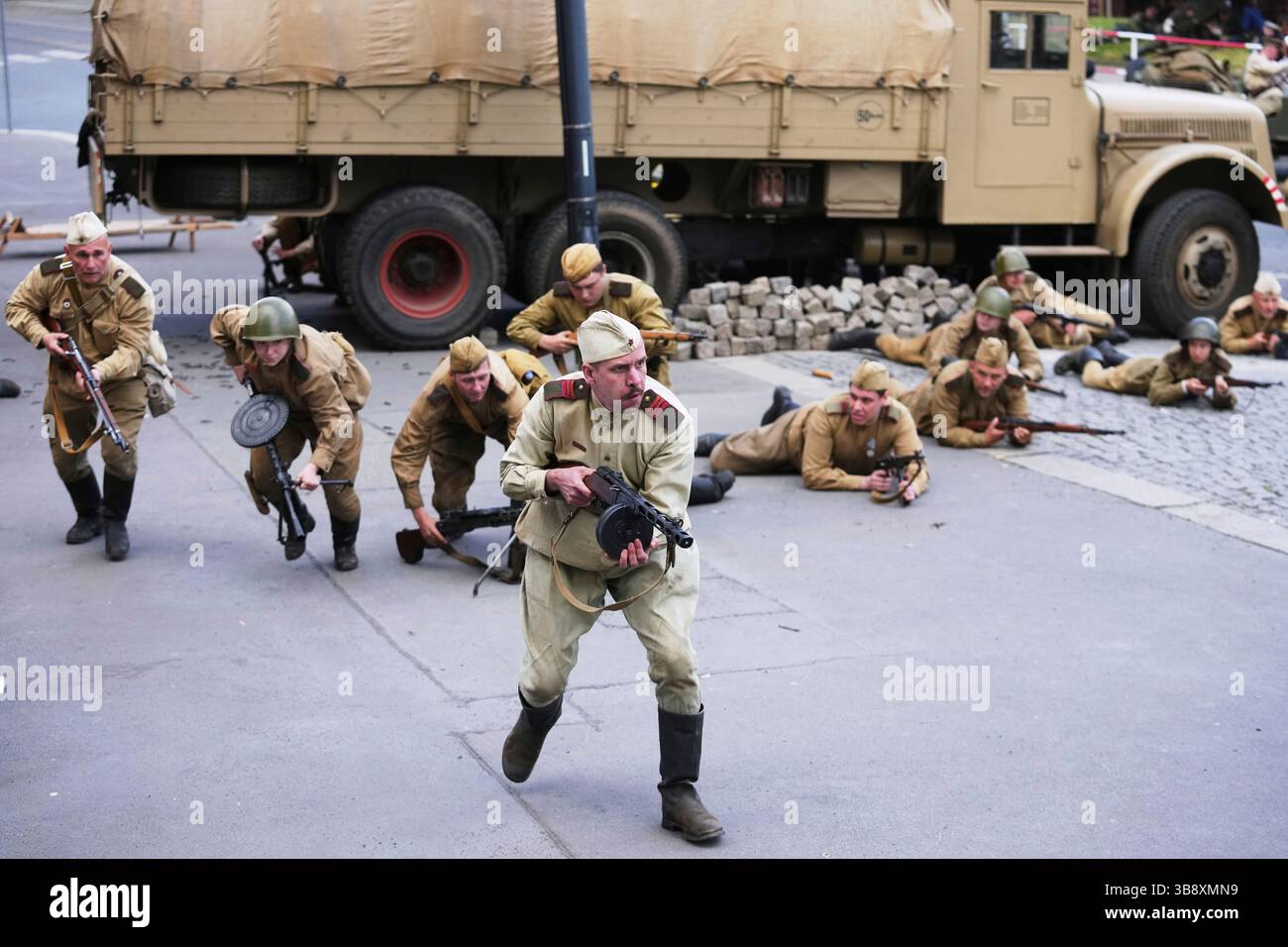 History enthusiasts take part in a reenactment of a battle, which was ...
