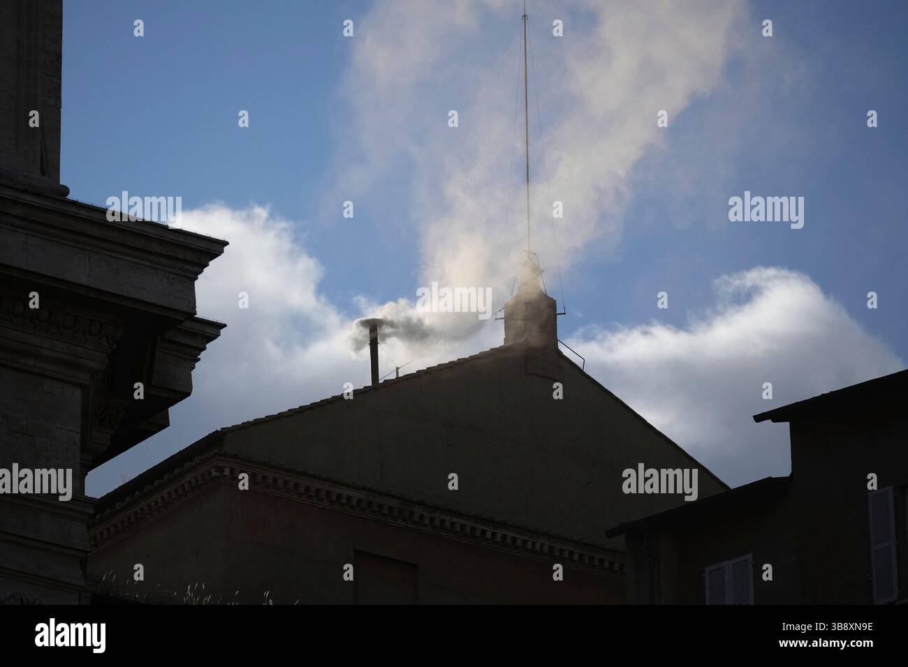 White smoke billows from the chimney of the Sistine Chapel during the ...