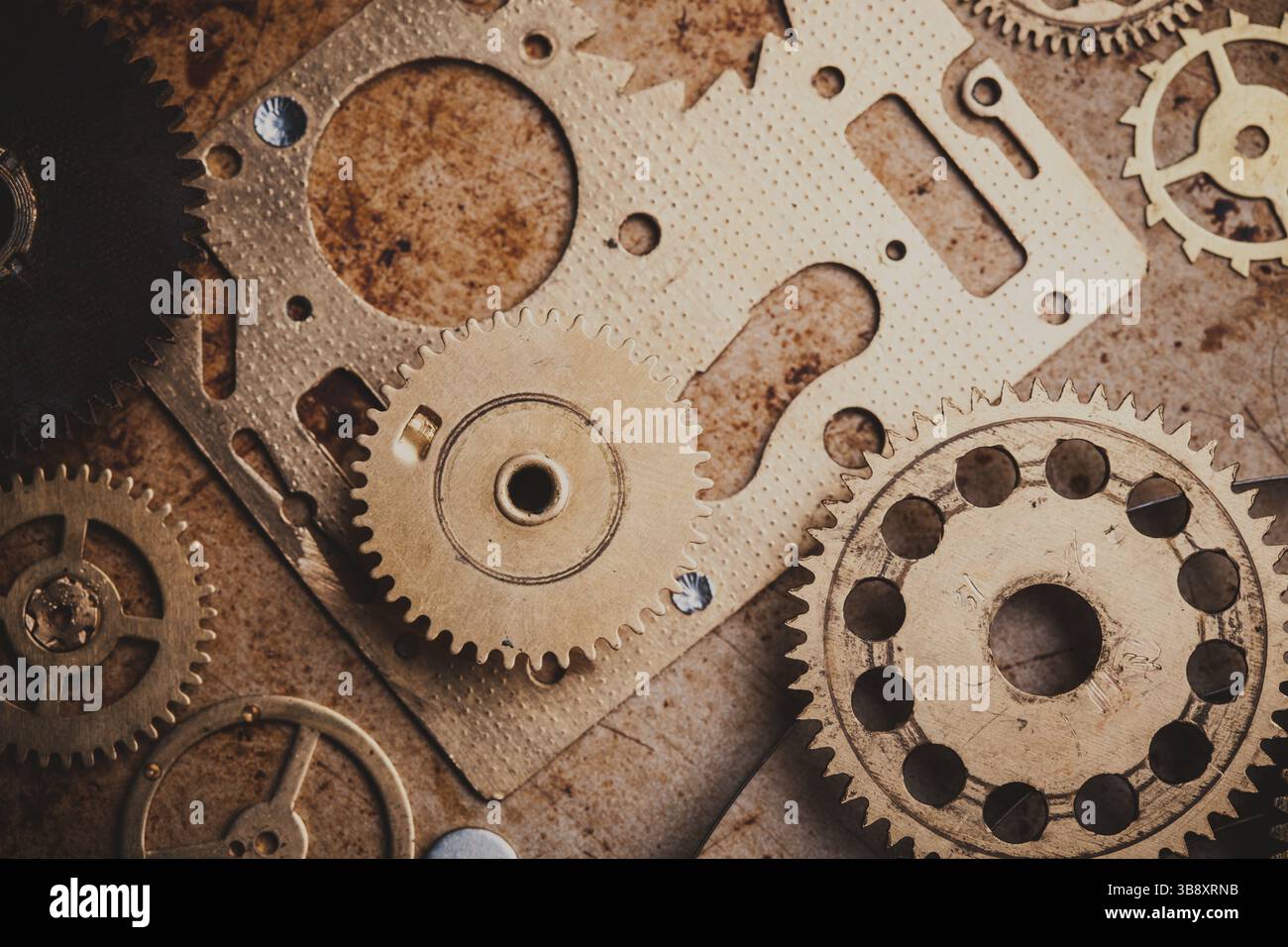 Steampunk background from mechanical clocks details over old metal ...