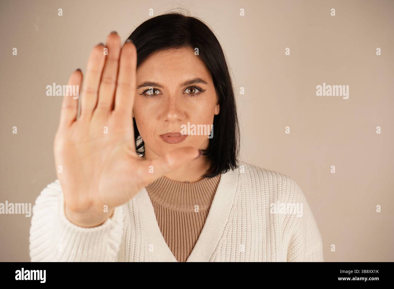 Both arms are raised high in a stretching gesture, symbolizing energy ...