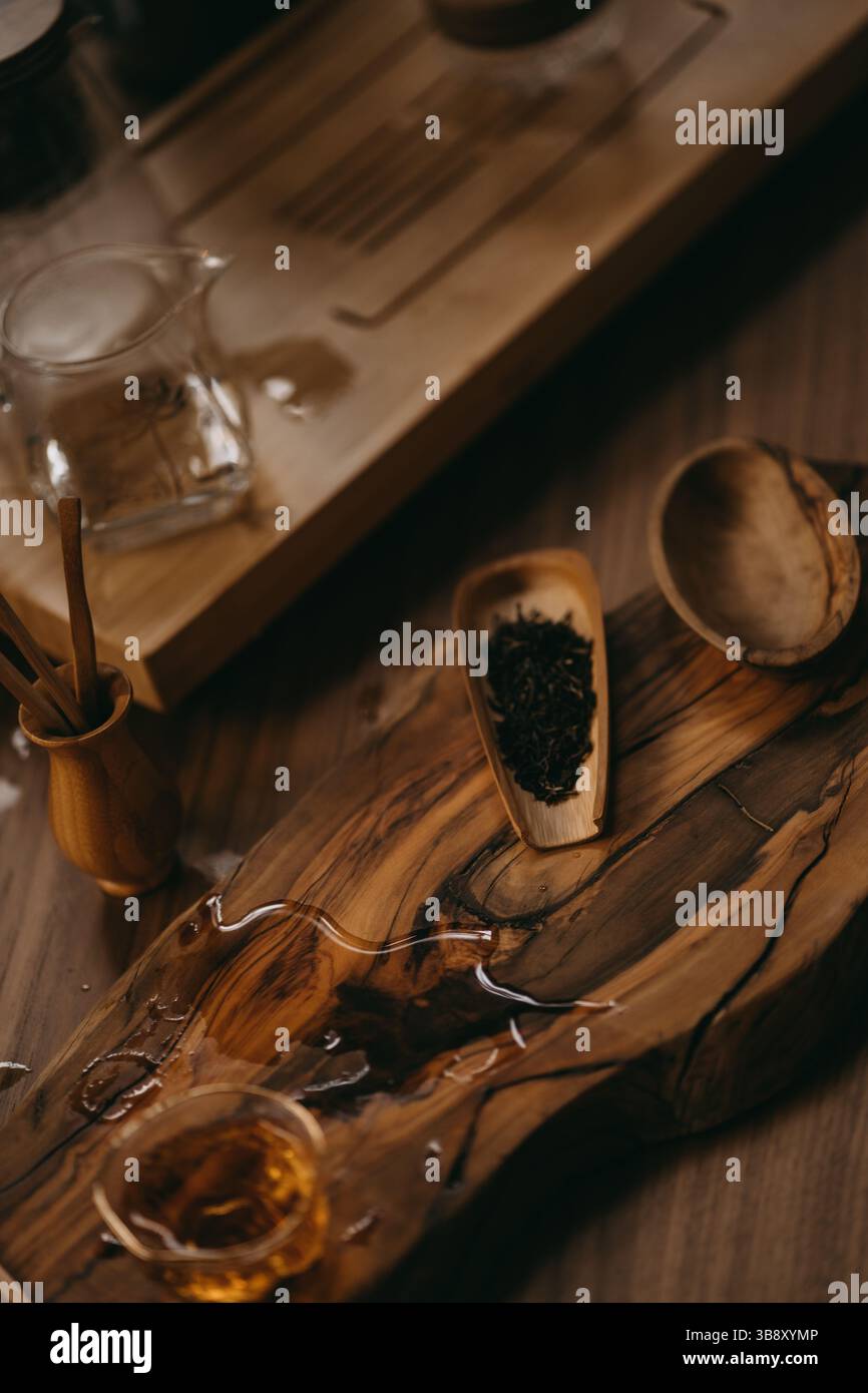 Traditional tea ceremony setup with glass cups, wooden utensils, tea ...