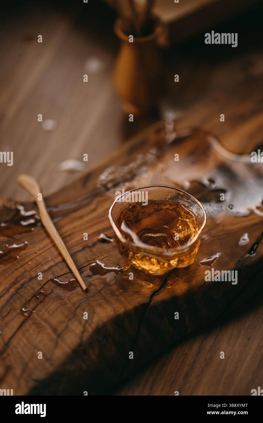 Traditional tea ceremony setup with glass cups, wooden utensils, tea ...