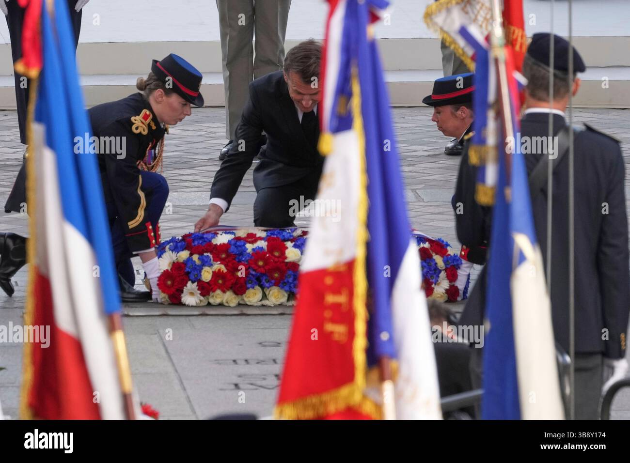French President Emmanuel Macron lays a wreath of flowers at the Tomb ...