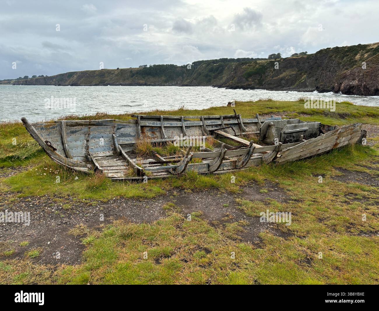 Abandoned Scottish fishing wooden boat. Rusty metal and ruined wood ...