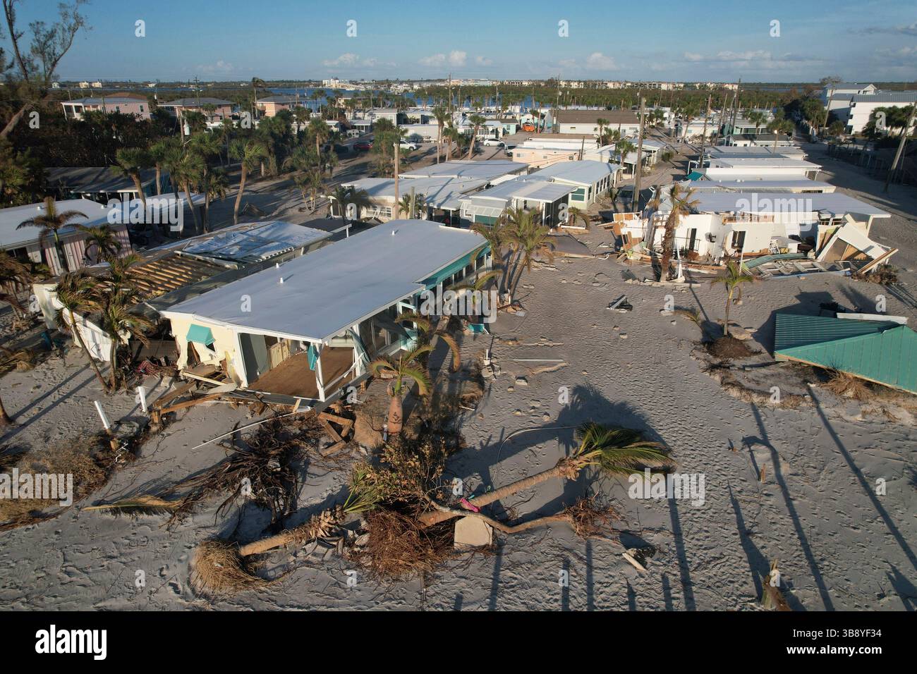 FILE - Damage from Hurricane Milton is seen at a mobile home community ...