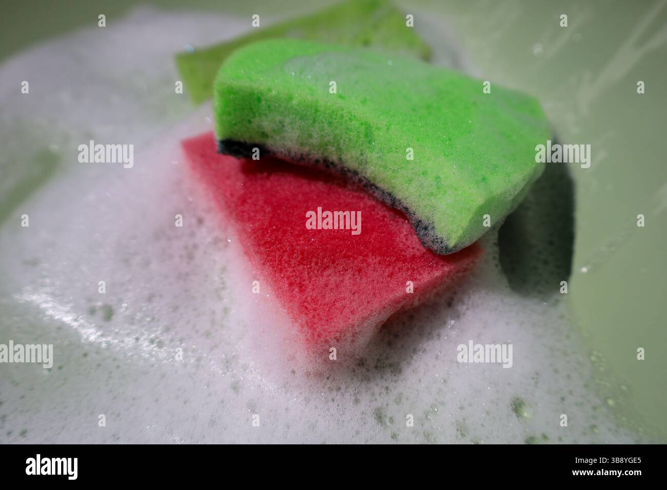 Foam sponge for washing dishes washing dishes with a sponge Stock Photo ...
