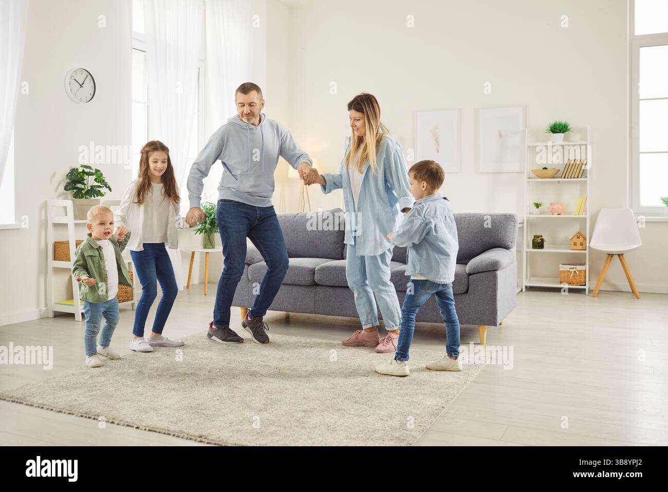 Happy big family fun dance, overjoyed married couple dancing in new ...