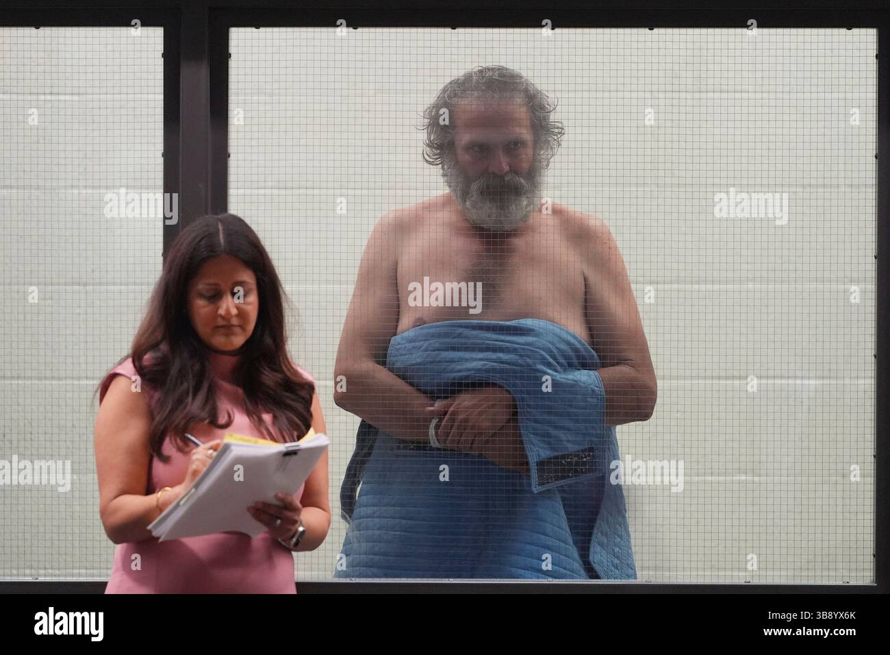 Jimmy Wayne Carwyle, right, appears during an arraignment next to ...