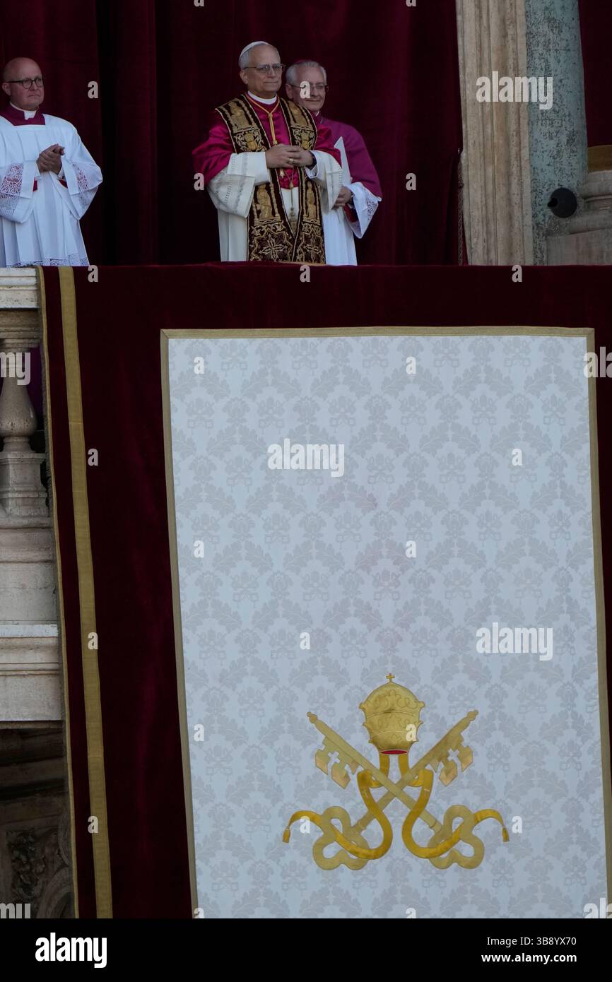 Pope Leo XIV appears on the balcony of St Peter's Basilica after his ...