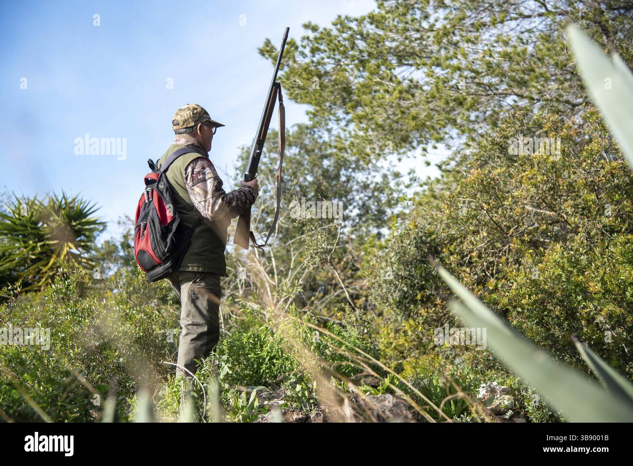 Backpack carrying weapon guy gun hi-res stock photography and images ...