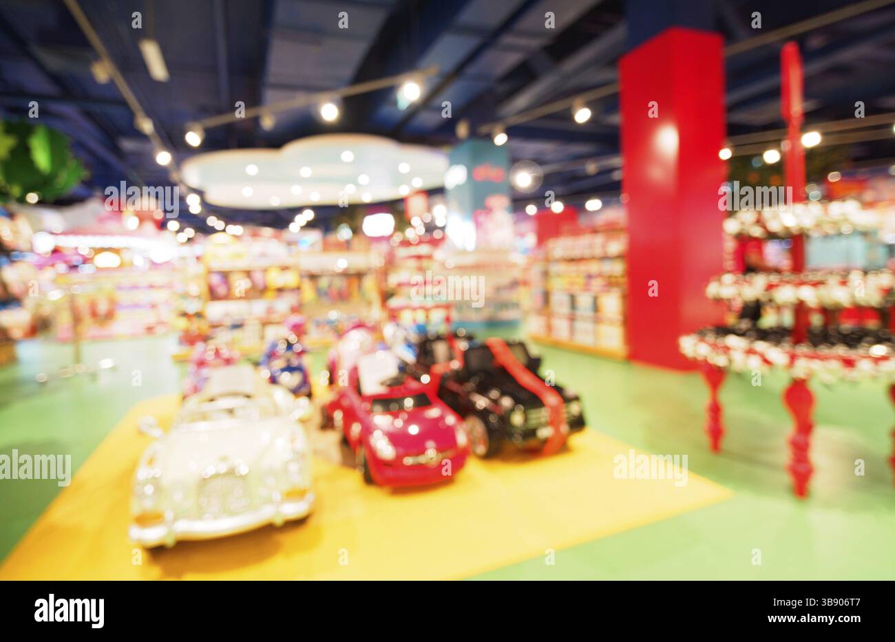 Blurred of kids toy store background with bokhe. shelves with cars and ...