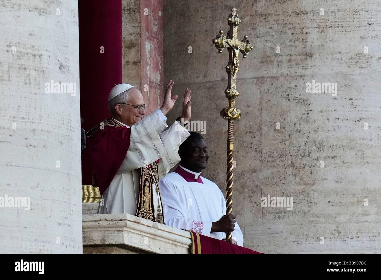 Pope Leo XIV appears on the balcony of St Peter's Basilica after his ...