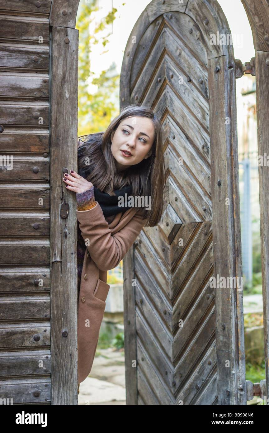 Girl by wooden gate hi-res stock photography and images - Alamy