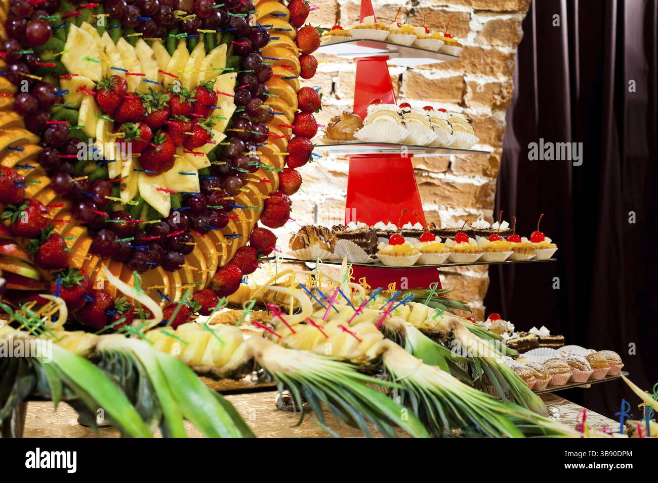 Pineapple swan, fruits lay design for event Stock Photo - Alamy