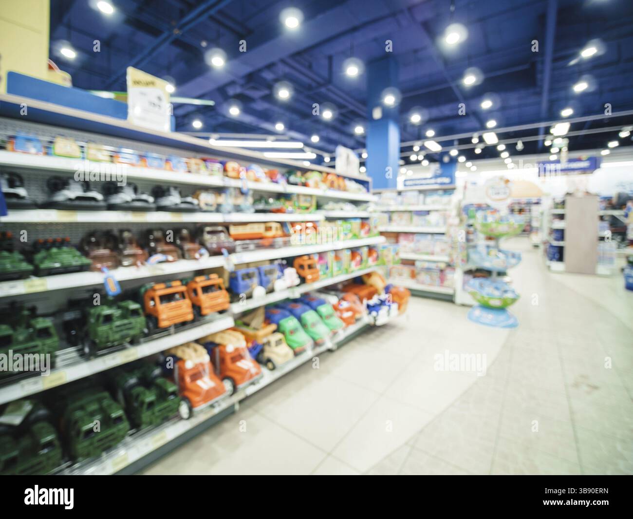 Blurred of kids toy store background with bokhe. shelves with cars and ...