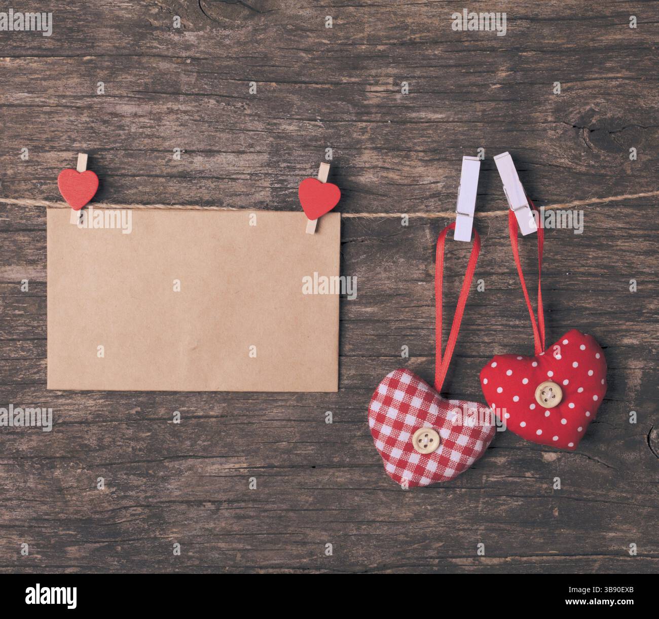 Two hearts and craft envelope .attached to the rope. Valentine ...