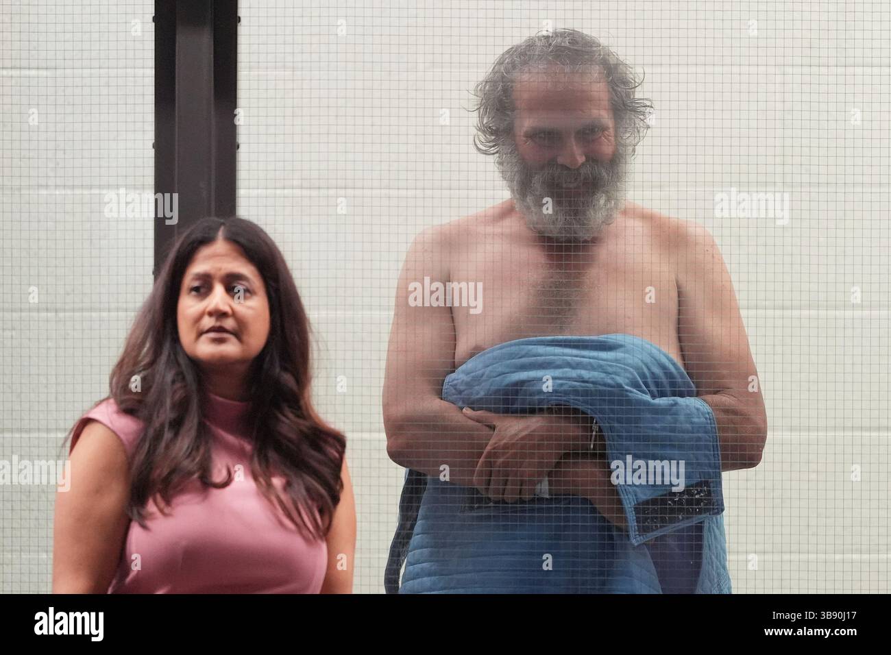 Jimmy Wayne Carwyle, right, smiles during an arraignment next to ...