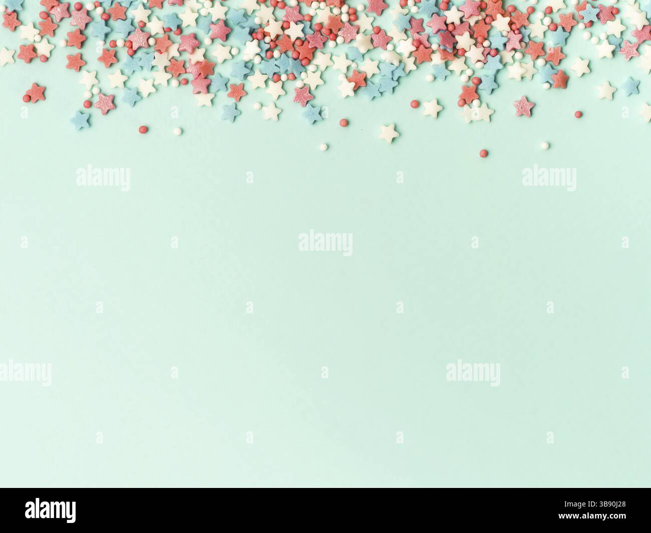 Festive border frame of colorful pastel sprinkles on blue background ...