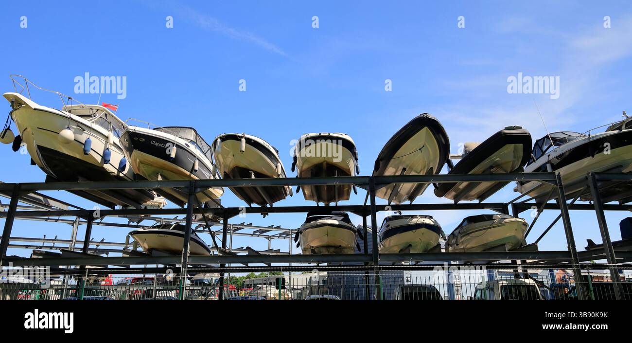 Boats stored on a high rack against blue sky. Taken May 2025 spring ...