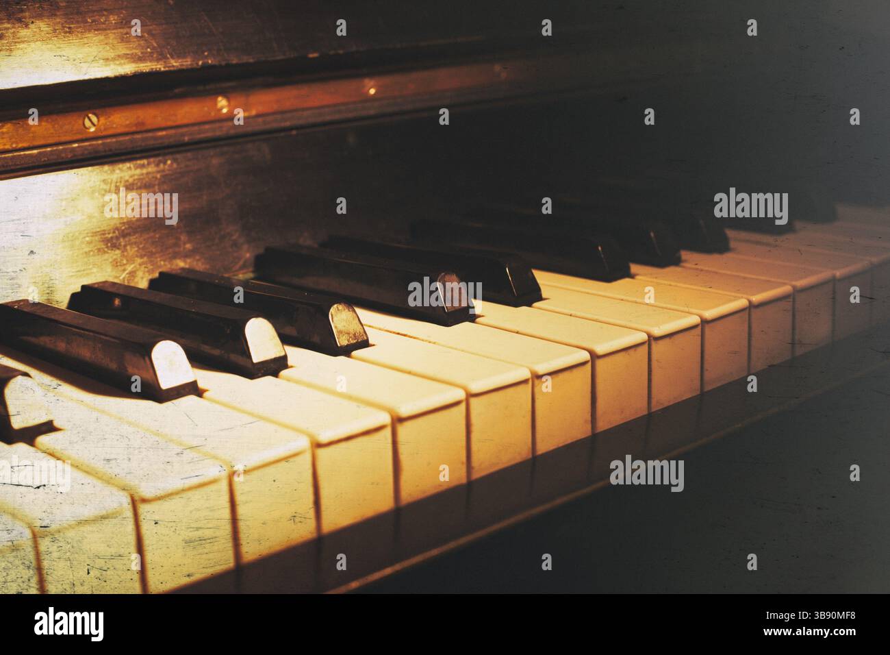 Old piano keyboard close up as a music background. With scratches and ...