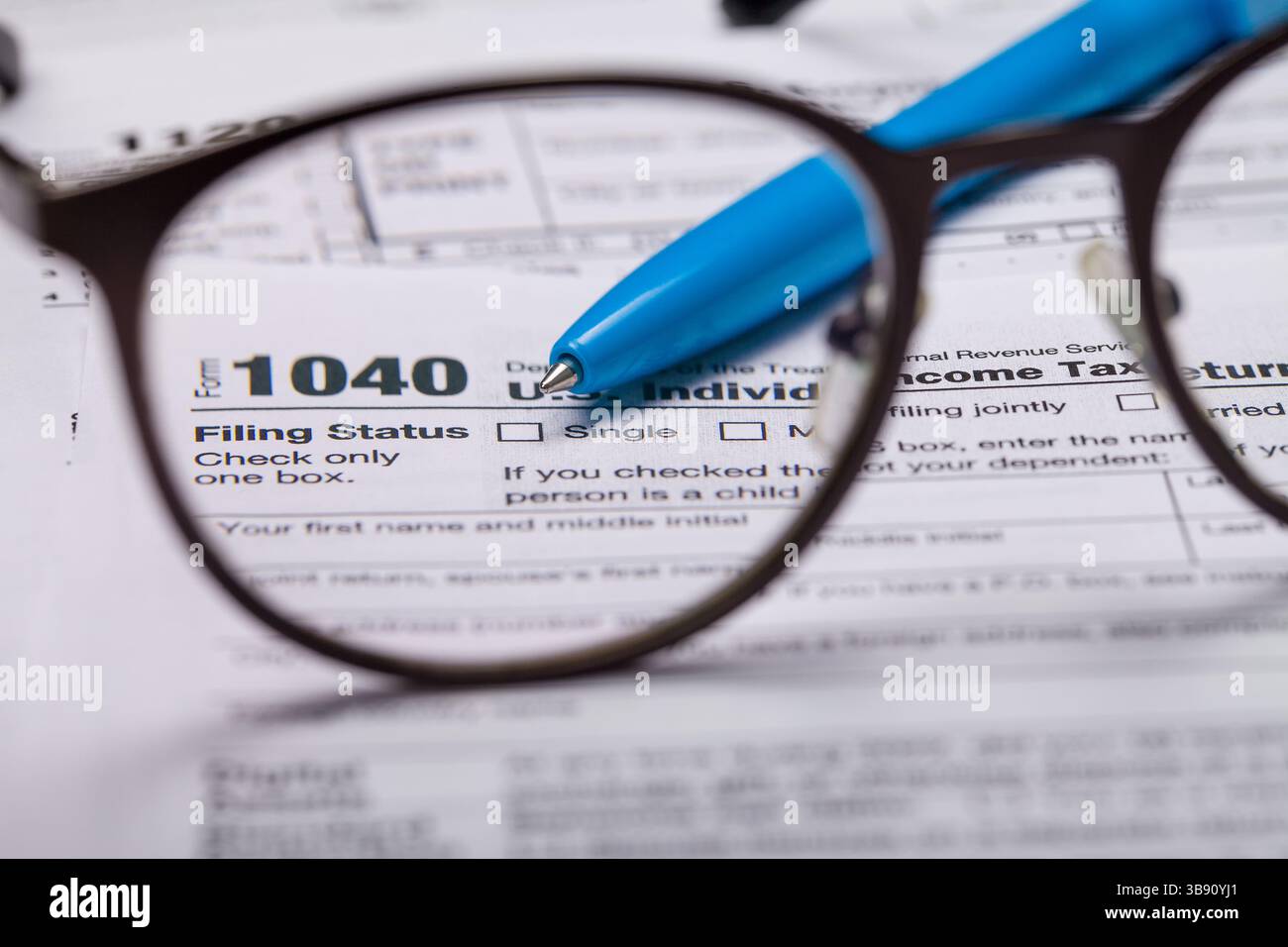 Income tax with instruction. Tax payment and filing concept. 2022 tax return form 1040, focus ...