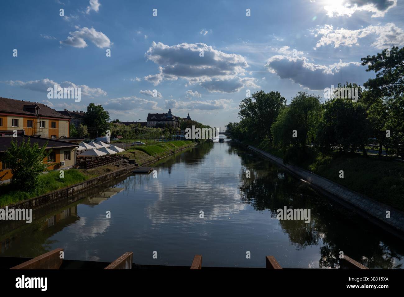 boat ride on the Bega River in Timisoara with reflections of the sky in ...