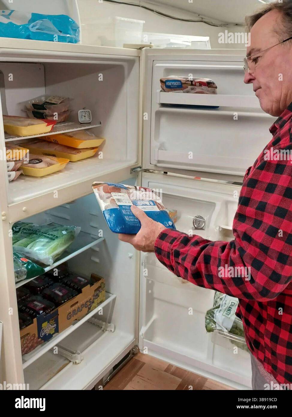 Volunteer Daniel Scannell checks some of the proteins the Sacred Heart ...