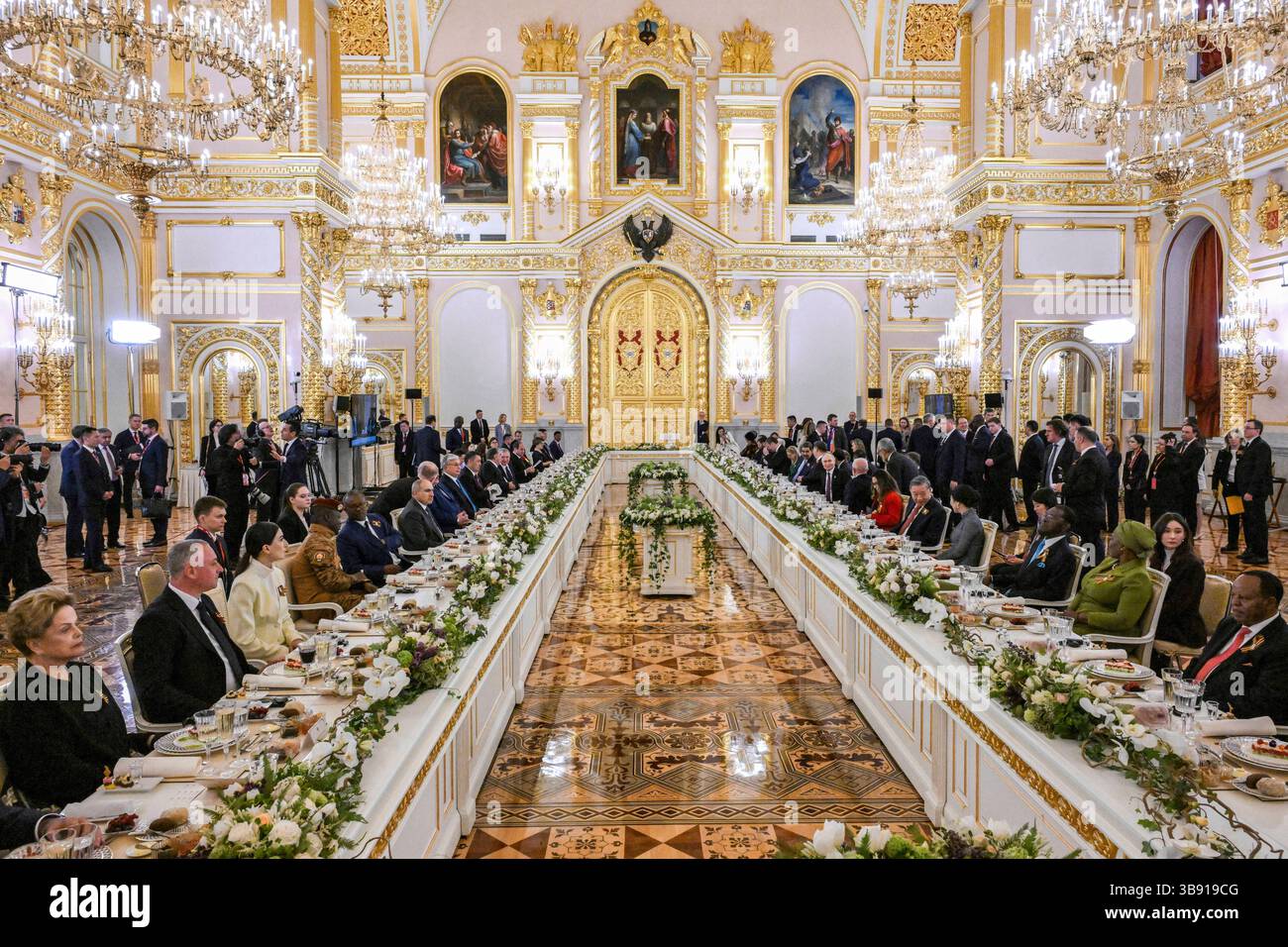 CORRECTS PHOTOGRAPHER Guests sit during a dinner on behalf of the ...