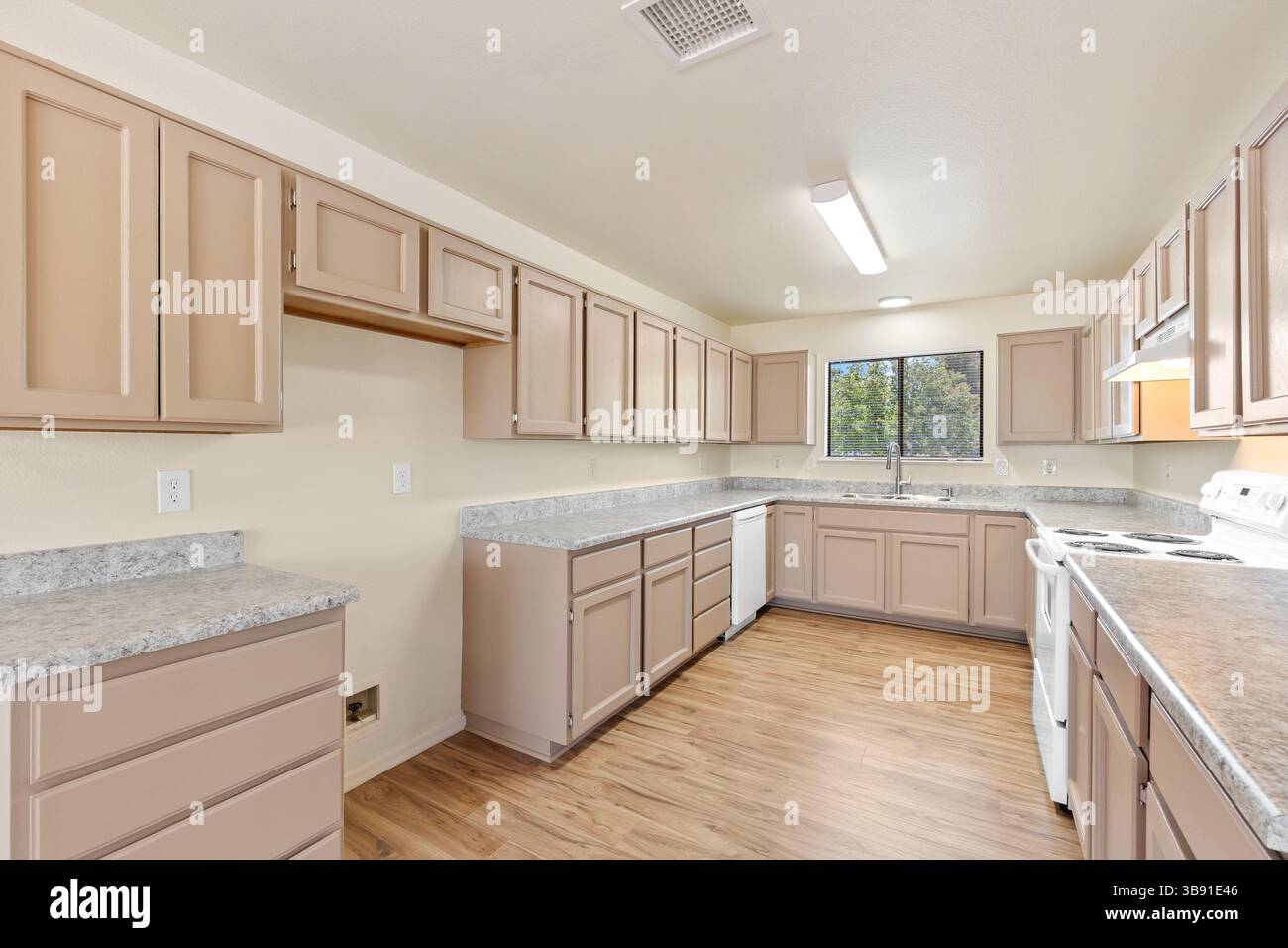 A beautifully designed kitchen featuring elegant wooden cabinets ...