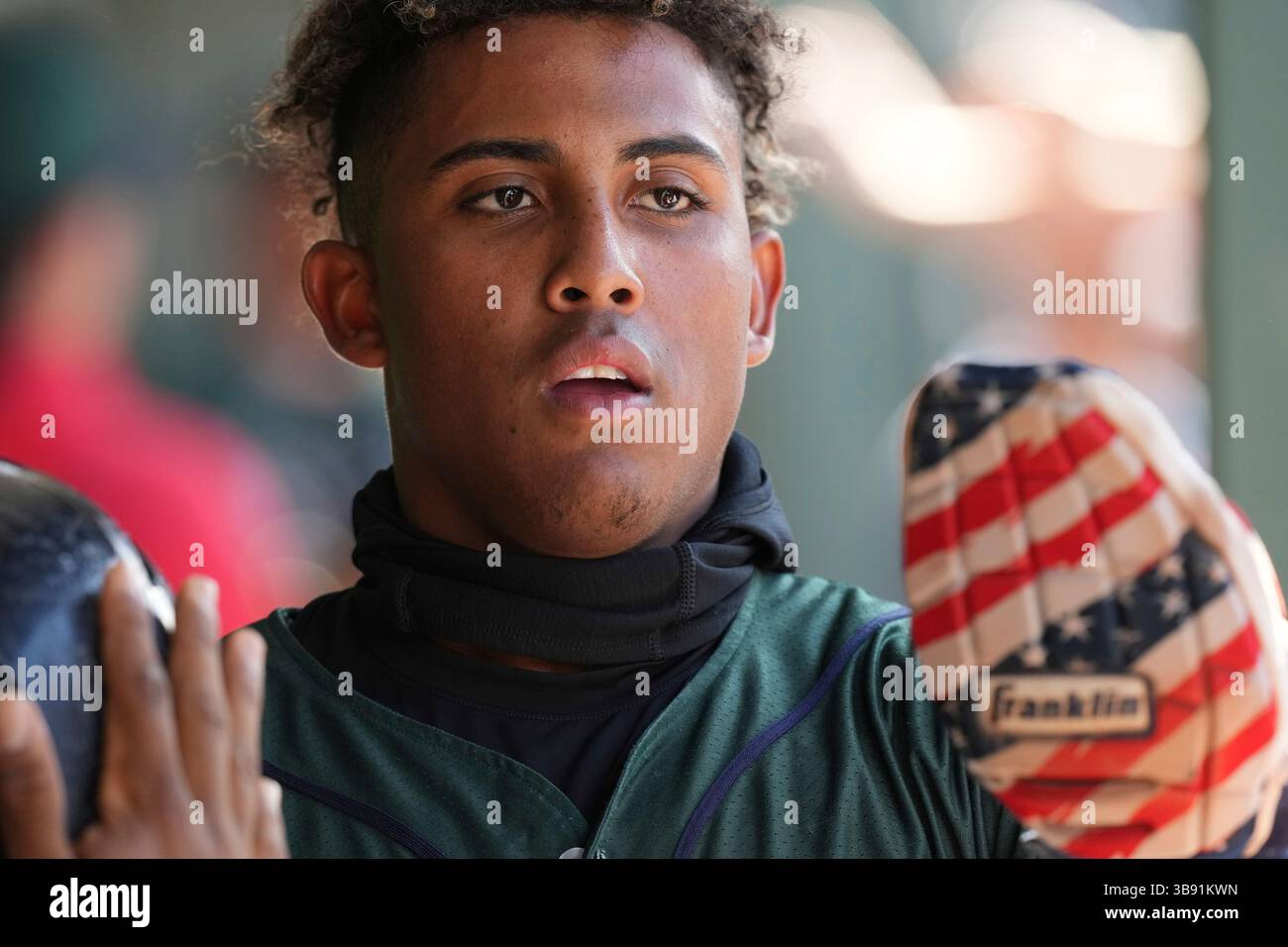 Marvin Alcantara (20) of the Greenville Drive is greeted in the dugout ...