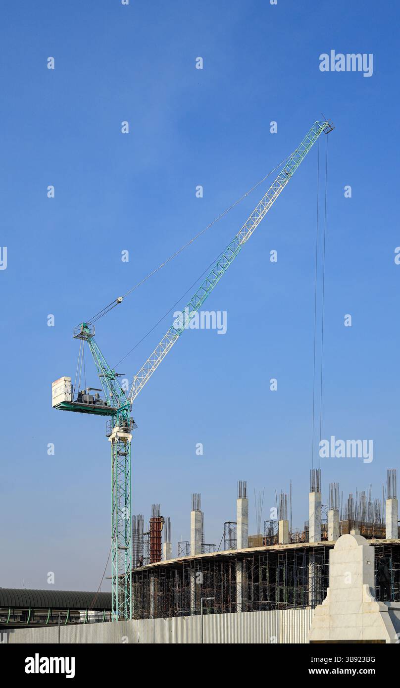 construction tower crane work with construction worker on top of ...