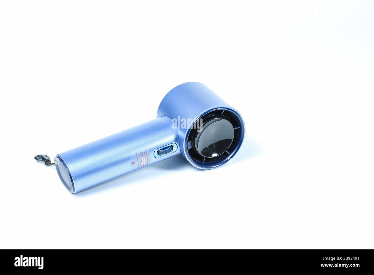 Small plastic Portable fan side view, isolated on white background ...