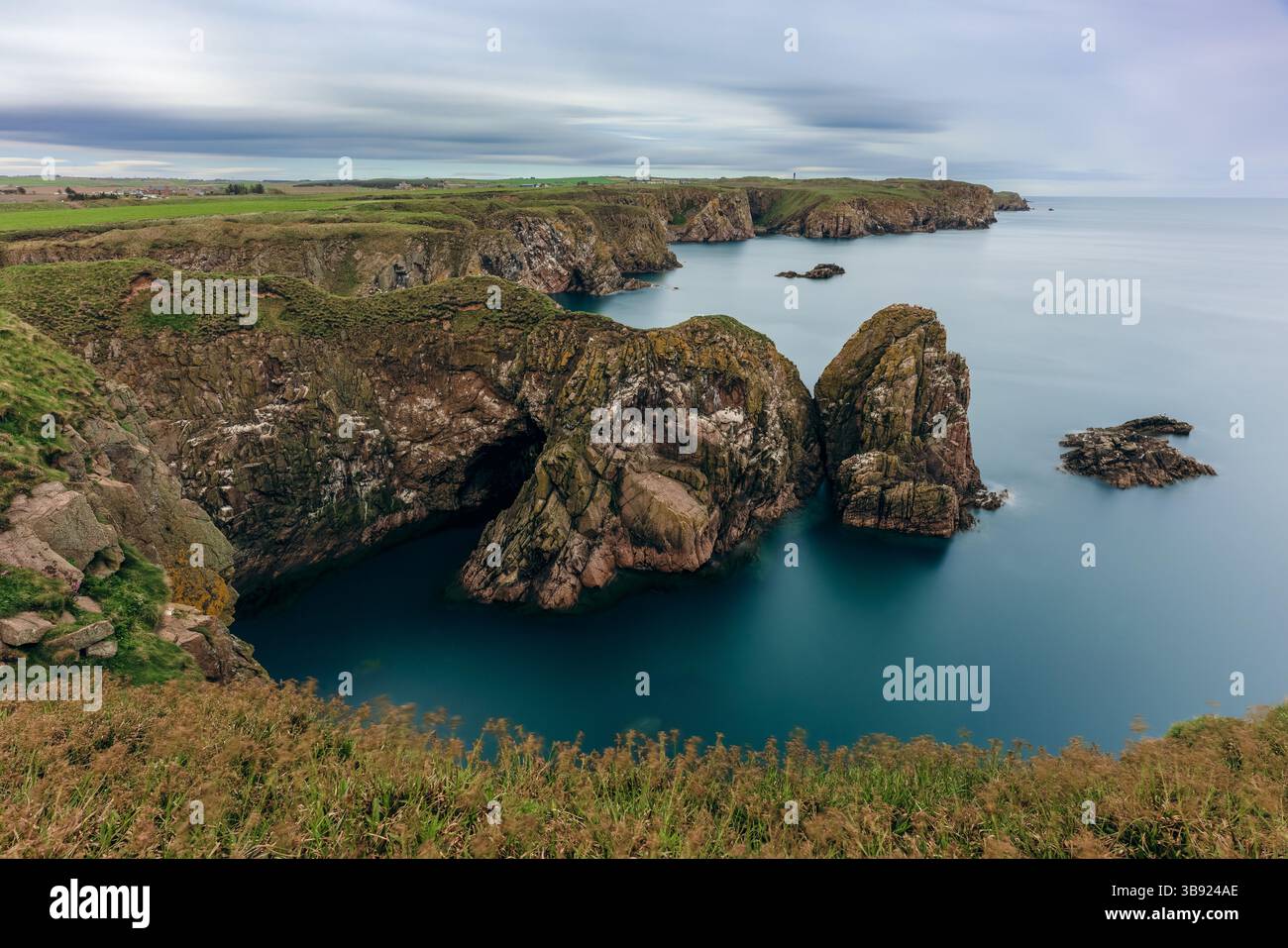 The rugged coast of Bullers of Buchan is located south of Peterhead in ...