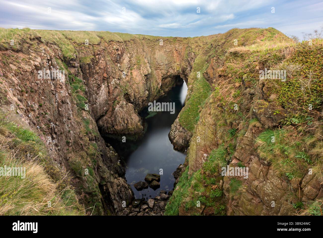 The rugged coast of Bullers of Buchan is located south of Peterhead in ...
