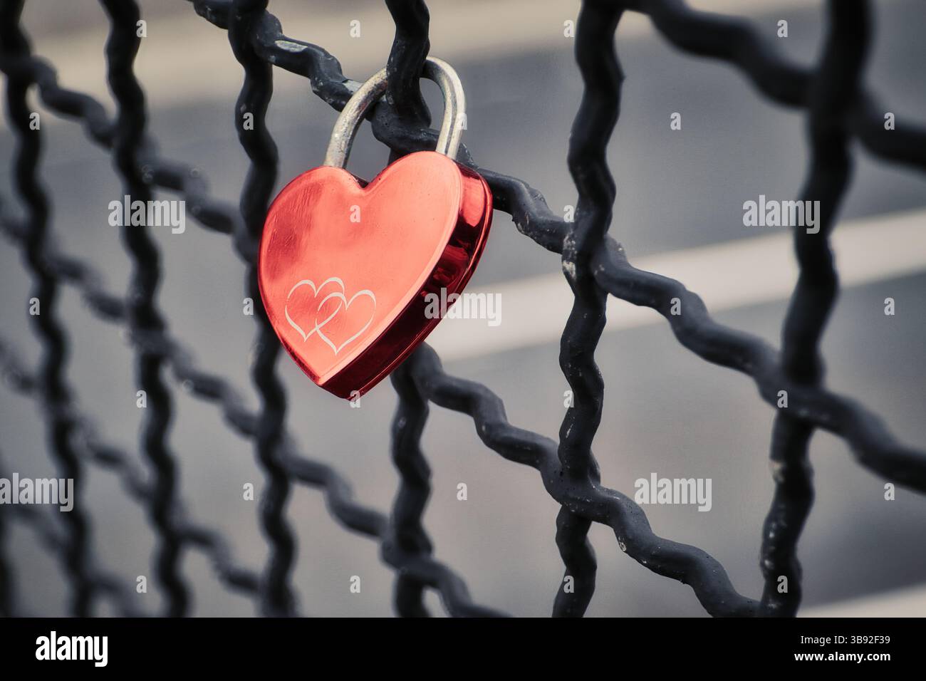 small red heart on the fence Stock Photo - Alamy