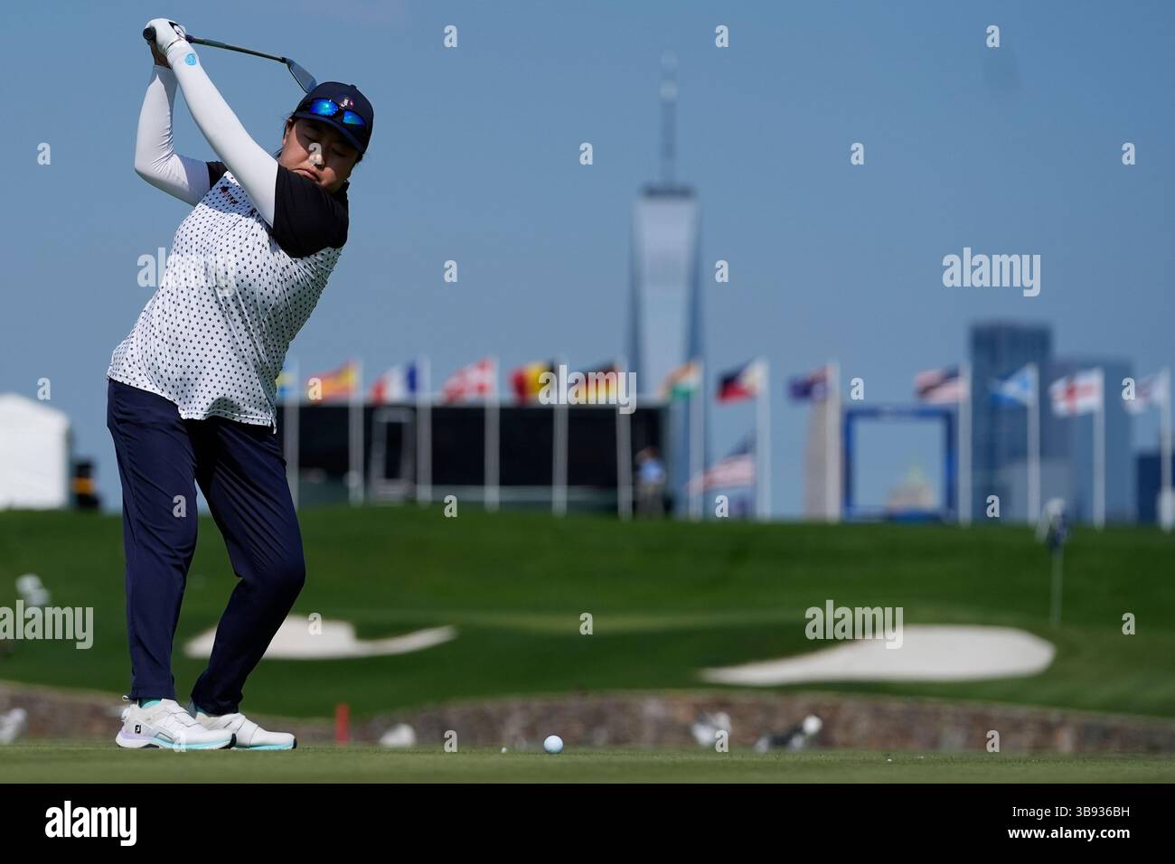 Ruixin Liu, of China, hits from the fourth tee during the first round ...