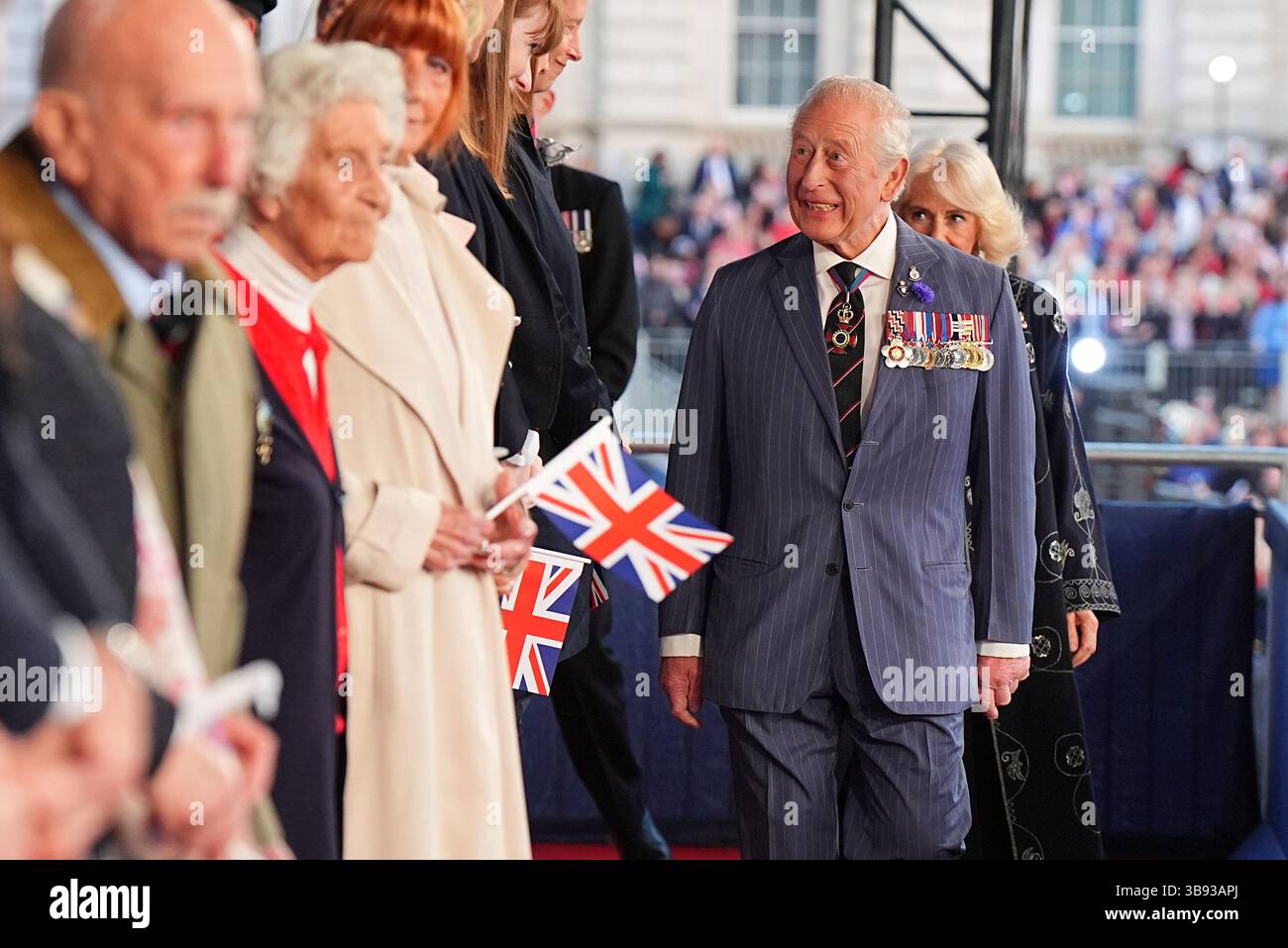 Britain's King Charles III and Queen Camilla arrive for the concert to ...