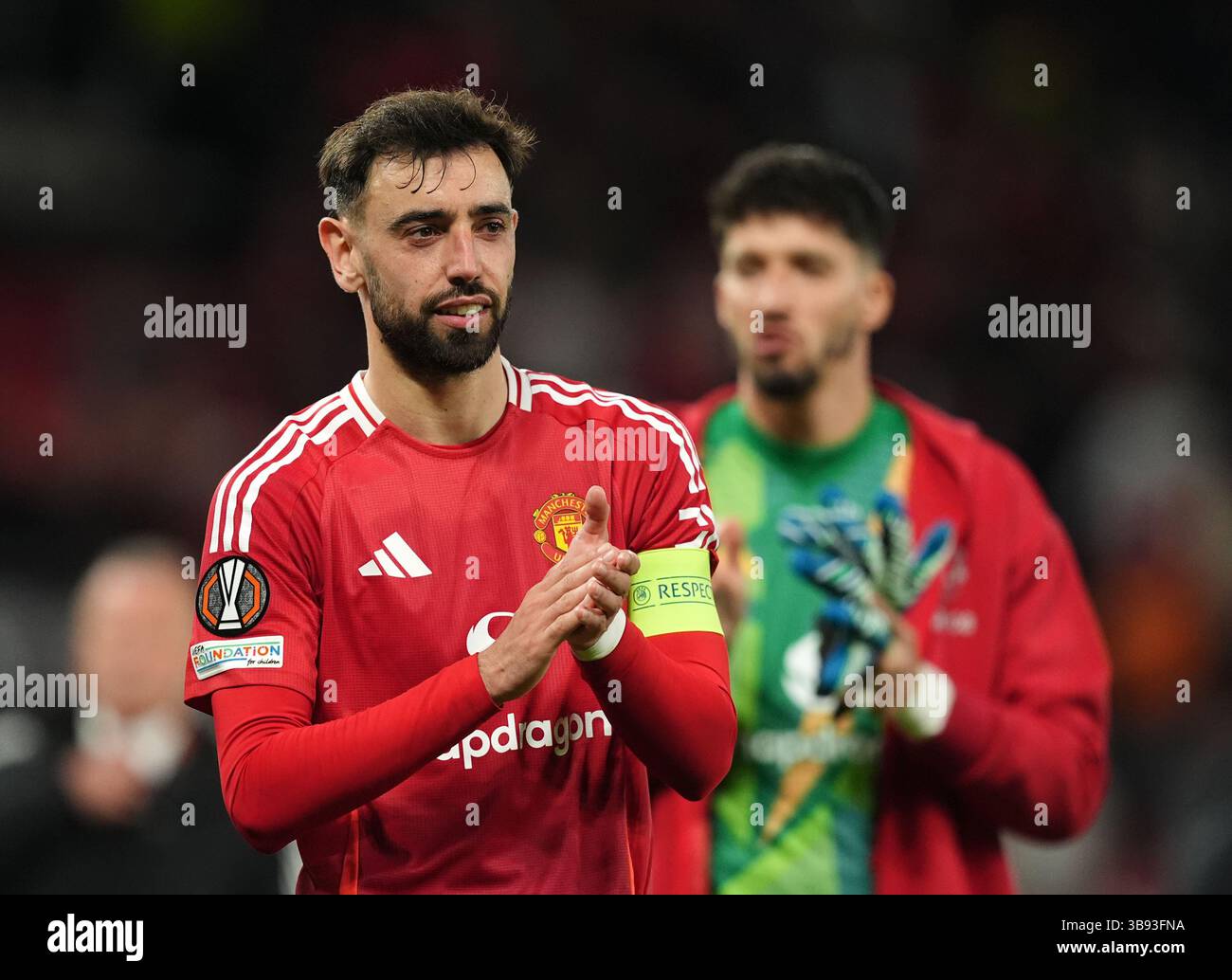 Manchester United's Bruno Fernandes applauds the fans following the ...