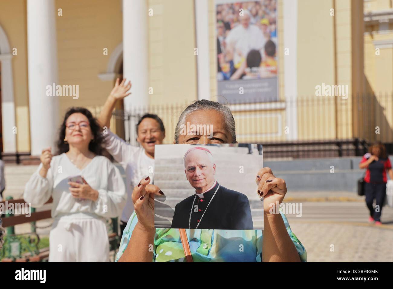 Faithful hold a photo of Bishop Robert Prevost, who was elected Pope ...