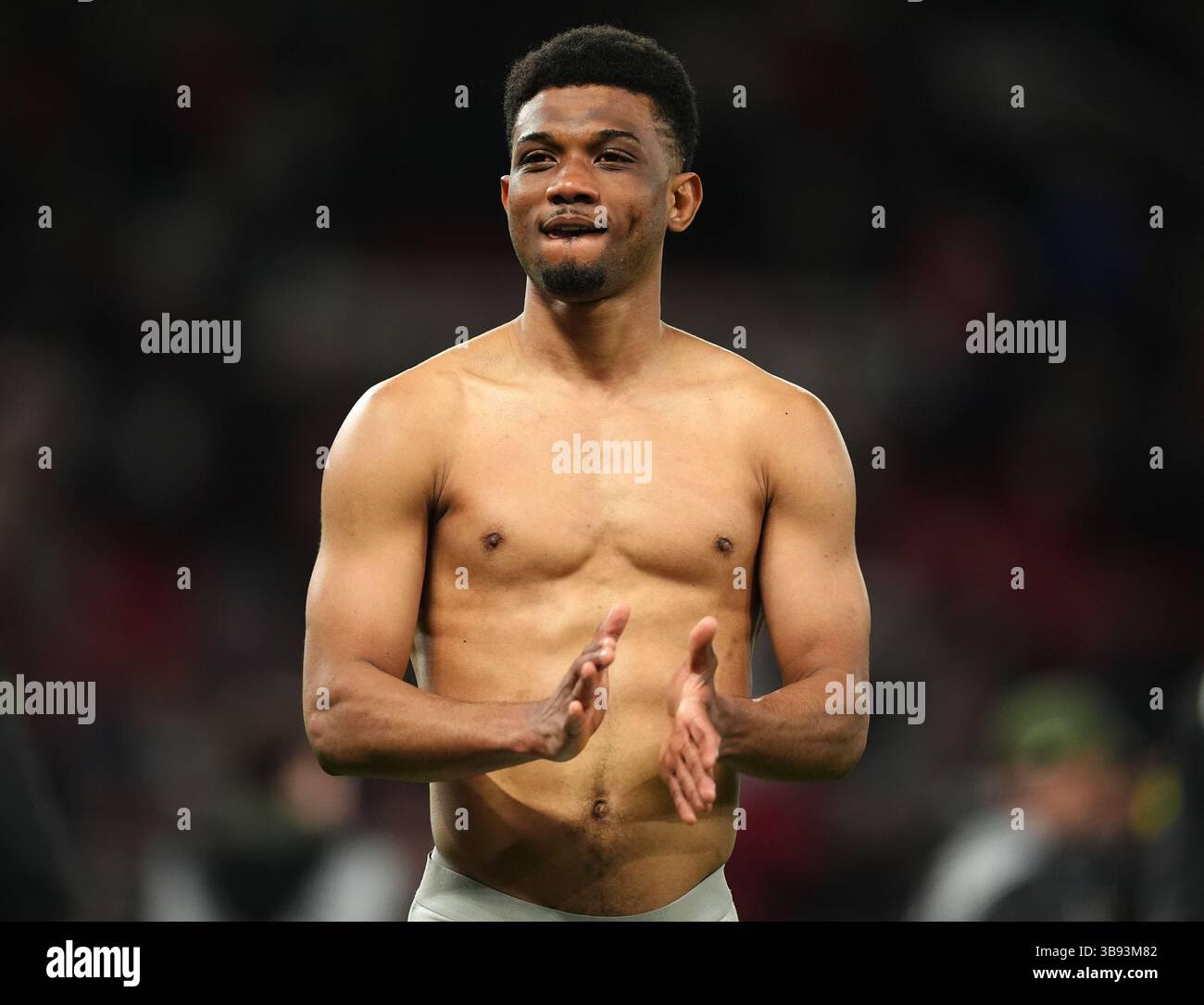 Manchester United's Amad Diallo applauds the fans following the UEFA ...